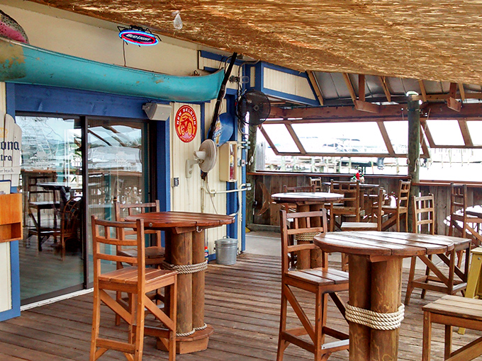 The patio doesn't just offer seating—it offers therapy with a view, where wooden tables and salt air heal whatever ails you.