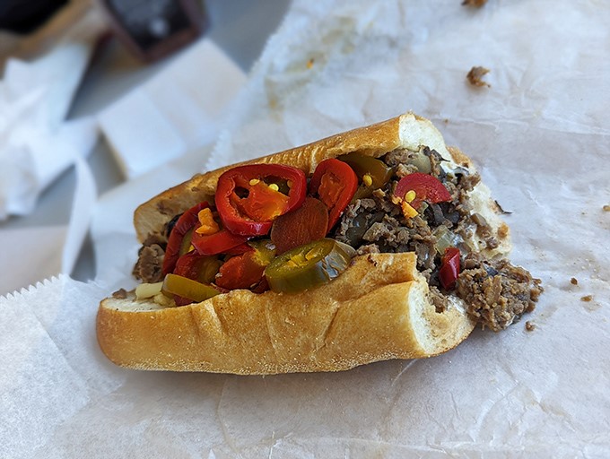 A cheesesteak with personality. Those peppers aren't just hanging out—they're having a flavor party and everyone's invited.