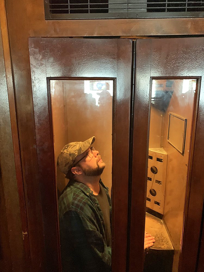 This vintage phone booth isn't for making calls—it's for time traveling to when dining out was an event, not just content for your feed.