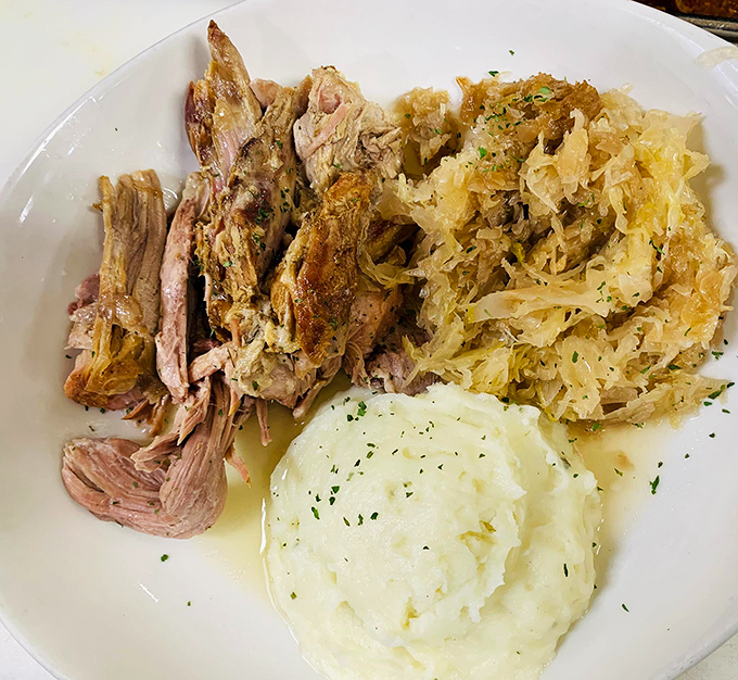 Pork and sauerkraut that honors Pennsylvania Dutch tradition—tender meat alongside tangy cabbage that's been properly introduced to flavor.