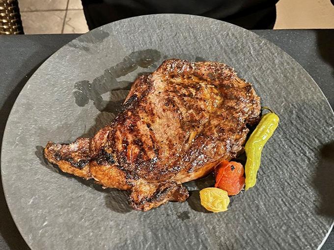 A ribeye with perfect grill marks that would make even seafood devotees temporarily question their loyalty. Surf and turf isn't cheating—it's having it all.