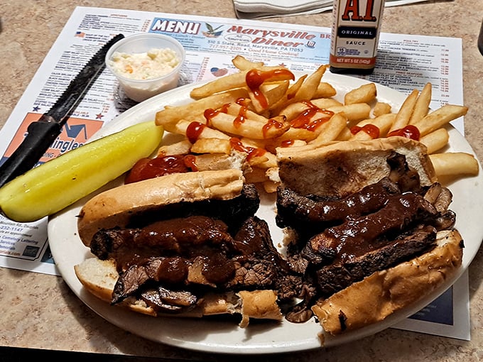 This isn't just a roast beef sandwich—it's a masterpiece of meat, bread, and fries that demands to be devoured.