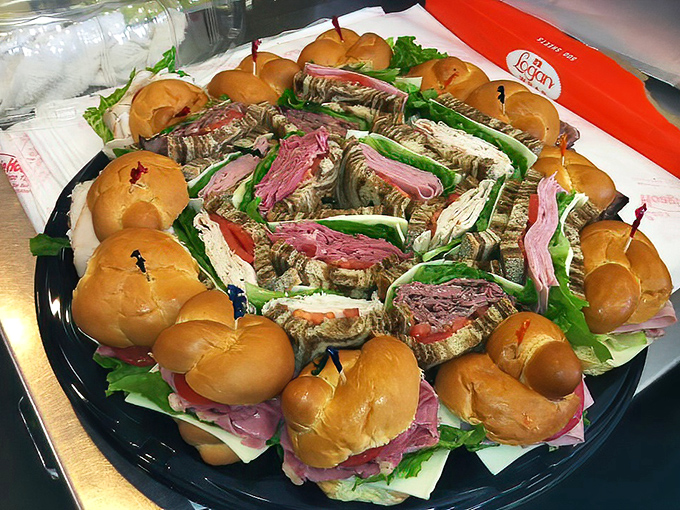 The sandwich catering tray—feeding a crowd with minimal effort and maximum appreciation. The circular arrangement practically guarantees everyone finds their perfect match.