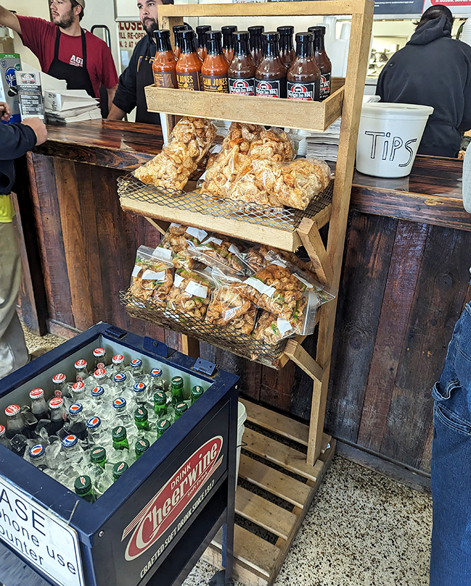 Cracklins and sauce—the supporting actors that deserve their own Oscar category in this whole hog barbecue theater of deliciousness.
