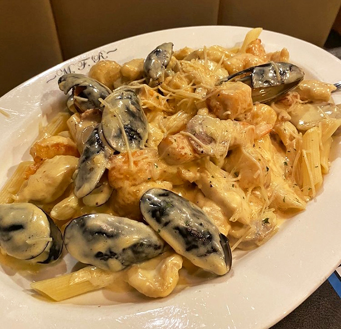 Seafood Stephanie – where cream sauce meets shellfish in perfect harmony. Those mussels look like they're swimming in a pool of pure indulgence.