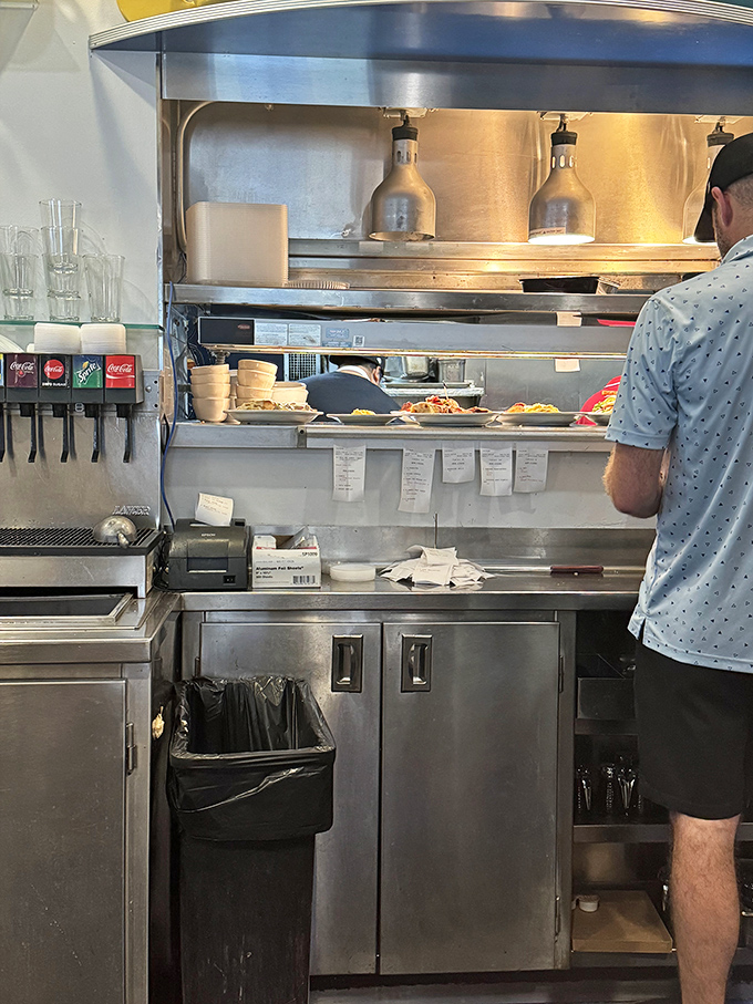 Behind the scenes where the magic happens—a kitchen choreography of short-order cooking that turns ordinary ingredients into extraordinary comfort.