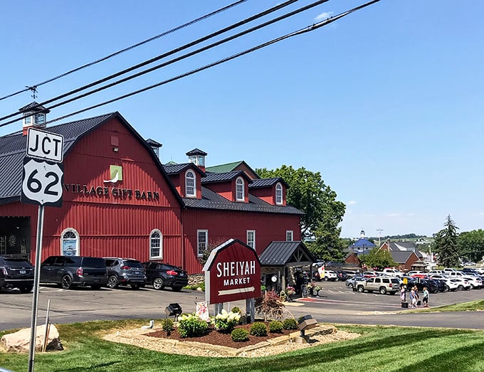 Sheiyah Market stands proud at the crossroads, a barn-red beacon for hungry travelers seeking everything from penny candy to artisanal cheese.
