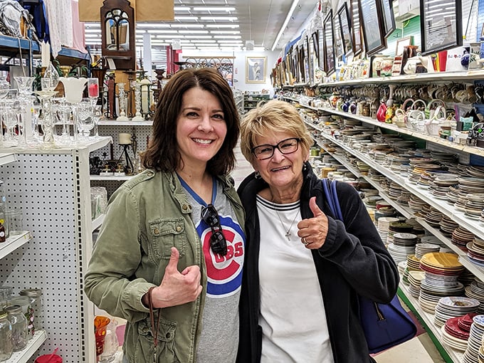 The universal language of thrift store triumph: thumbs up after discovering that perfect find among thousands of possibilities.
