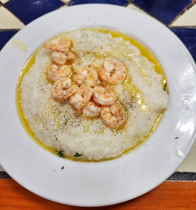 Shrimp and grits that would make a Southerner weep with joy—buttery, creamy comfort topped with perfectly seasoned crustacean jewels.