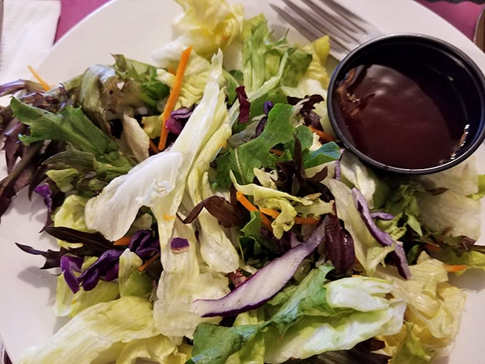 Even the side salad gets the respect it deserves—fresh, crisp, and a welcome palate cleanser between bites of beefy perfection.