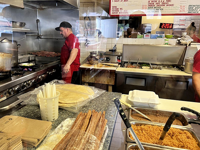The kitchen maestros at work. Like watching a delicious symphony where every movement ends with someone saying "más, por favor."