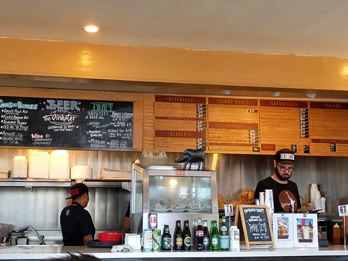 The menu board looms above like the scoreboard at Dodger Stadium, except here, everyone wins regardless of what they order.