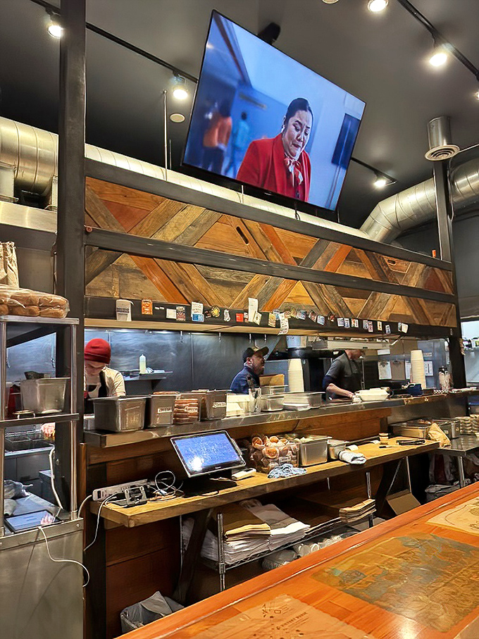 Where the magic happens. The open kitchen lets you watch skilled hands transform humble chicken into transcendent meals.
