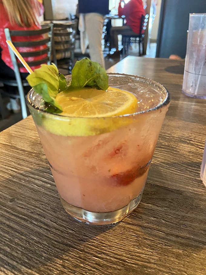 This isn't just a cocktail—it's summer in a glass, with strawberry and basil playing off each other like old friends at a beach party.