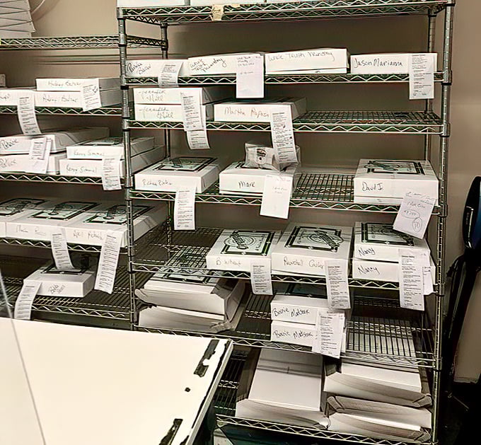 The organized chaos of takeout orders reveals the method behind the sweetness. Each box destined for office heroes and family breakfast legends.