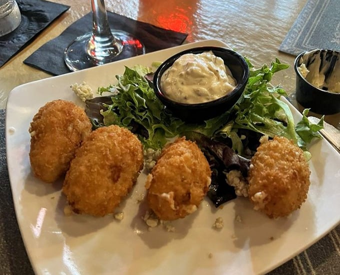 Golden-fried perfection meets garden-fresh greens. These aren't your drive-thru tater tots—they're a sophisticated nod to childhood favorites.