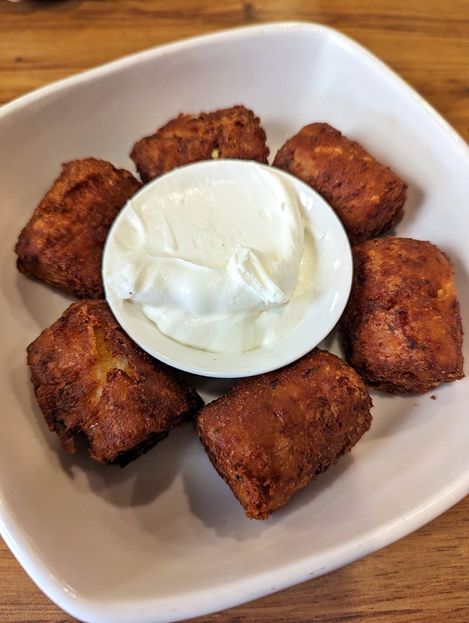 Tavern Tots: When regular tater tots dream of greatness, this is what they aspire to become—golden, crispy, and ready for dipping.