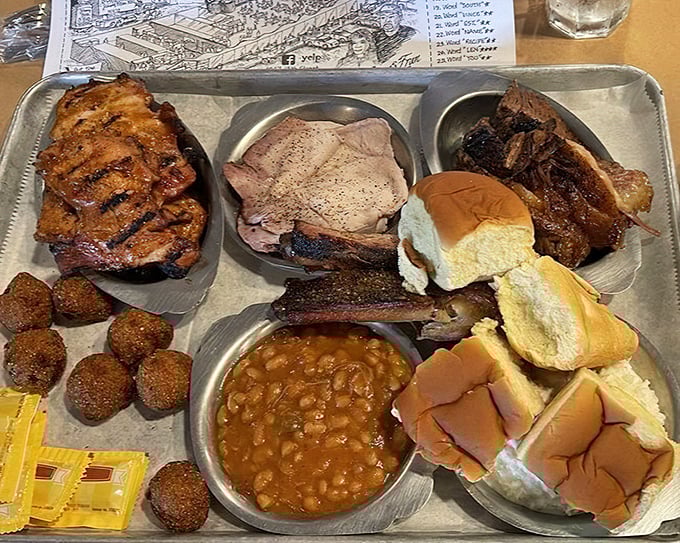 The "Baby Bear" platter isn't for cubs—this serious spread features multiple meats, sides, and bread that could satisfy a hibernating grizzly.