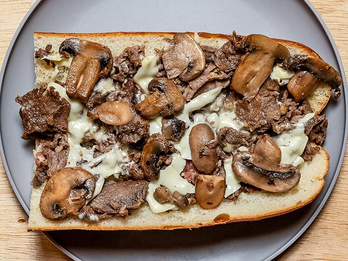 The glorious "mush" – that perfect marriage of meat, cheese, and bread that makes a proper cheesesteak worth every napkin you'll need.