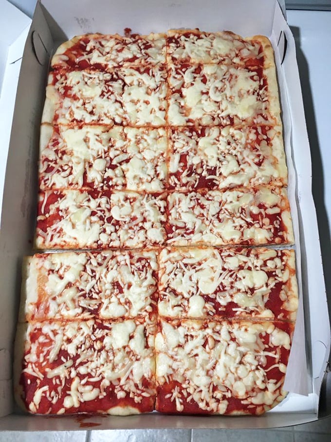 The classic tomato pizza in its takeout box—ready to transform your kitchen table into the best restaurant in town.