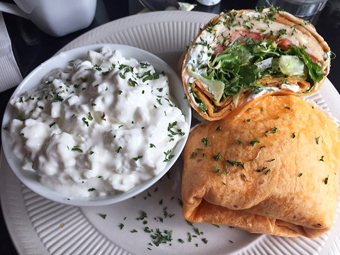 This wrap isn't just lunch – it's edible architecture with layers of flavor and that side of creamy potatoes is stealing the spotlight.