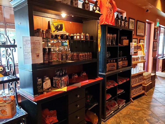 A retail corner featuring local spirits and branded merchandise – because the best souvenirs are the ones you can taste again.