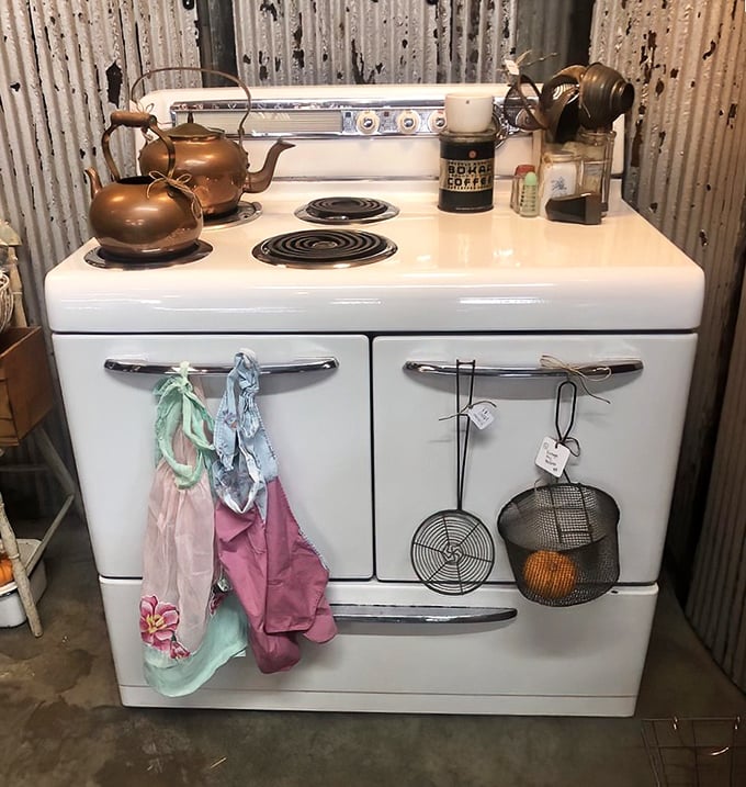 That gleaming white stove isn't just kitchen equipment—it's a monument to Sunday dinners when calories weren't counted and recipes weren't Googled.
