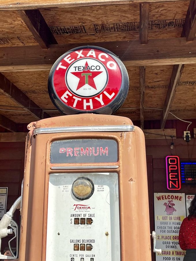 That vintage Texaco pump isn't pumping gas—it's pumping nostalgia. A reminder that the best things in life take time, just like proper BBQ.