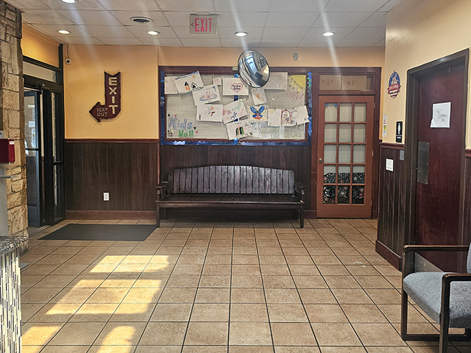 The waiting area's bulletin board tells the community's story—a patchwork of local events, children's drawings, and neighborly connections.