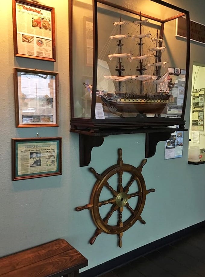 Maritime memorabilia that tells you the people here take their seafood seriously—ship's wheel included, no extra charge.