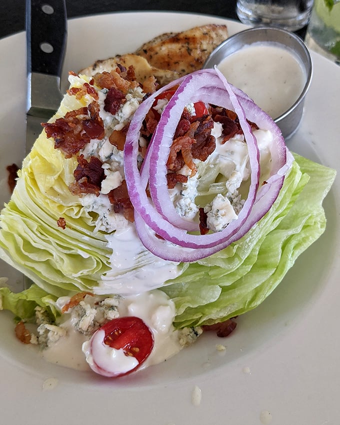 The wedge salad—proof that lettuce can dress up for a fancy night out when accompanied by bacon and blue cheese.