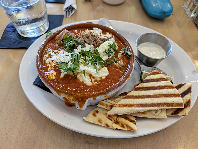 Shakshuka that demands to be photographed before eaten. White beans and carnitas prove that fusion isn't just a buzzword—it's breakfast evolution.