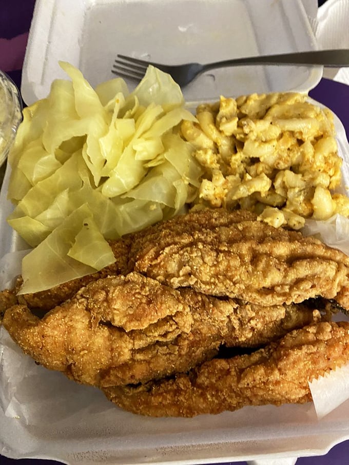 This whiting filet wears its golden crust like a badge of honor, while mac and cheese and cabbage stand by as worthy companions.