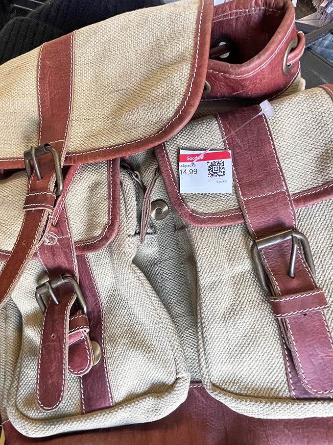 A sturdy canvas messenger bag with leather trim priced at $14.99—ready to carry your laptop, lunch, and thrifting victories.
