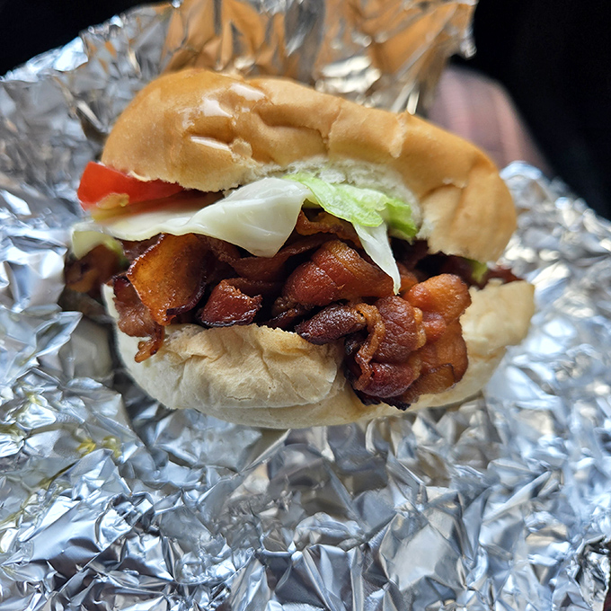 This bacon-loaded sandwich isn't just lunch – it's a masterclass in texture, flavor, and the art of proper meat-to-bun ratio.