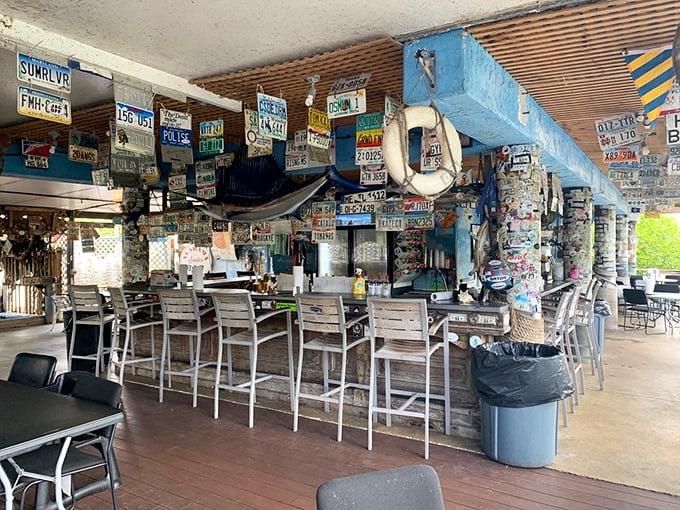 The bar at Alabama Jack's doesn't need fancy mixologists or Edison bulbs—just cold drinks and a view that beats any big-city skyline.