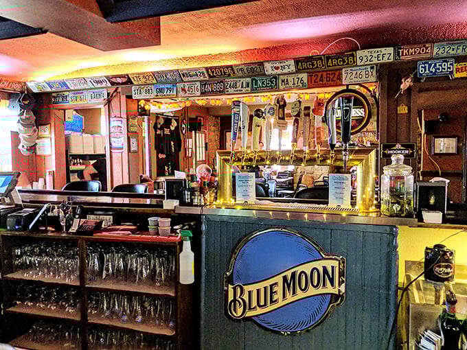 A bar adorned with license plates from visitors far and wide—proof that good barbecue is worth crossing state lines to experience.