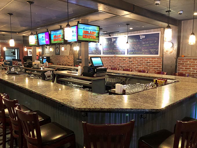 The bar area beckons with promises of craft beers and camaraderie. Exposed brick and multiple screens ensure you'll never miss the game while discovering your new favorite drink.