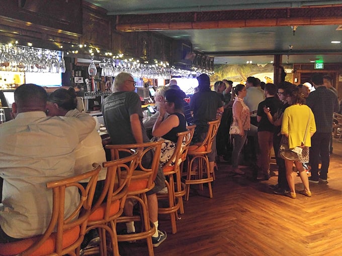 The bar scene at Damon's – where strangers become friends and friends become slightly louder friends as the Mai Tais work their magic.