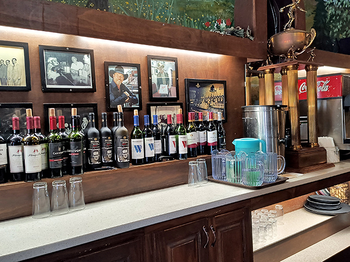 The bar area—where wine bottles stand at attention, ready to complement your carb-loading adventure with appropriate Italian dignity.