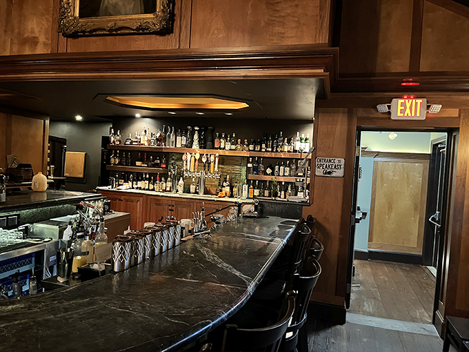 A bar that invites lingering conversations and "just one more" moments, with bottles promising adventures from around the world.