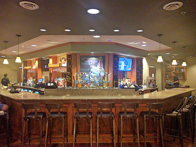 A bar that says "pull up a stool and stay awhile"—where the bartenders probably know more local secrets than the town historian.