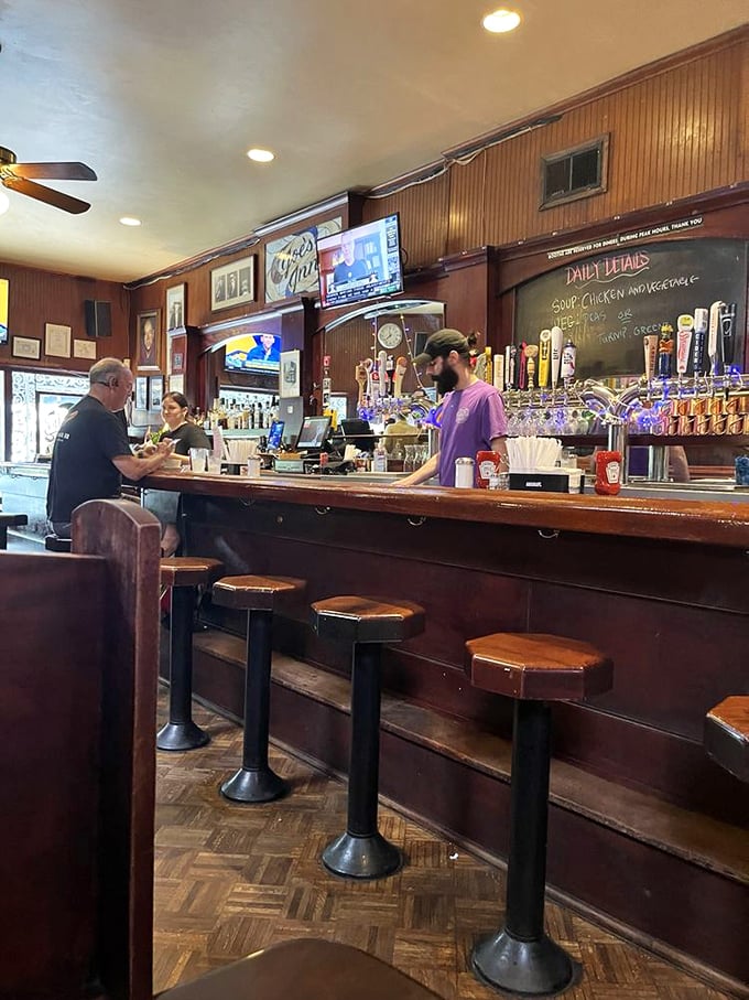 The bar at Joe's Inn – where regulars become family, bartenders remember your usual, and the stools have supported decades of stories.