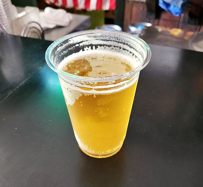 The perfect companion to Nashville heat—a cold beer that promises to extinguish the fire while enhancing the flavor. Liquid courage for your next bite.