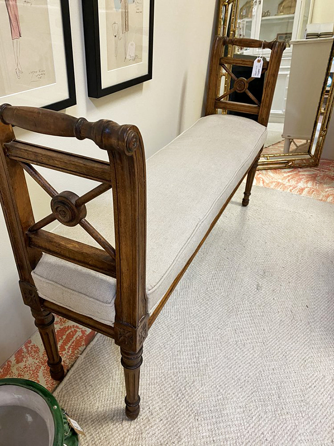 This elegant bench wasn't just made – it was crafted. Those X-patterns and turned legs speak a design language modern furniture has forgotten.
