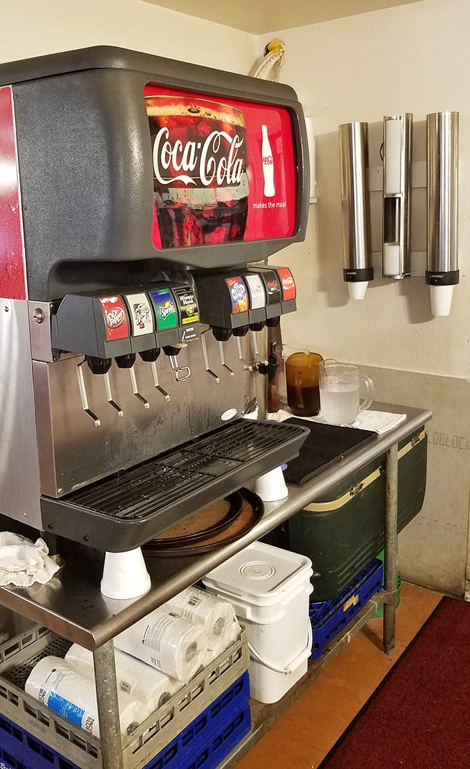 The soda fountain—where decisions get serious. Do you go classic cola or wild cherry? Life's important choices happen right here at this humble station.