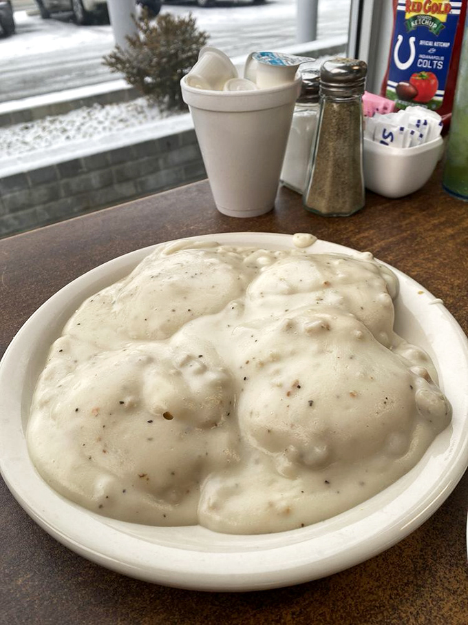 Biscuits and gravy that look like clouds floating in a sea of peppery sausage goodness – breakfast nirvana on a plate.