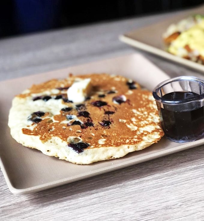 Blueberry pancakes that taste like summer vacation memories—light, fluffy, and dotted with berries that pop with each bite.