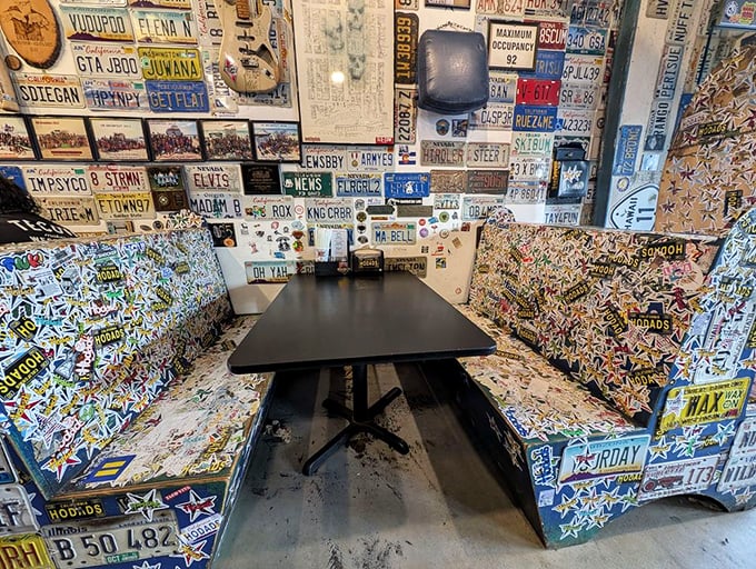 Every inch of this booth tells a story—thousands of stickers and mementos creating a visual history of hungry visitors past.