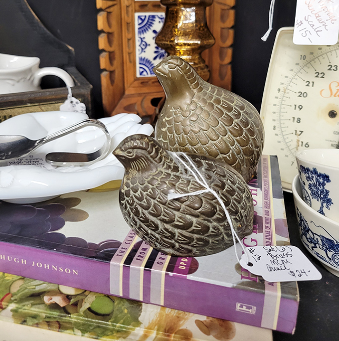 This brass quail perched atop vintage cookbooks seems to ask, "Which recipe will you try first?" Some treasures are practical, others purely decorative.